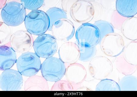 Blue, pink and transparent crowded spheres faded composing a colorful ...