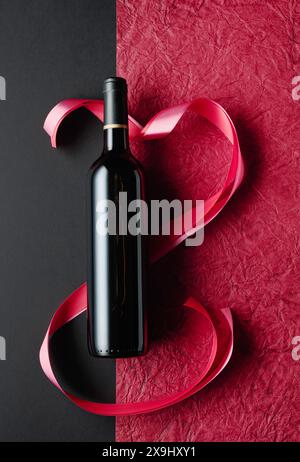 Bottle of red wine with satin ribbons. Top view. Copy space Stock Photo ...