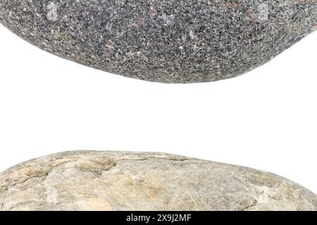 Edges of two pebbles isolated on white background with a space for text ...