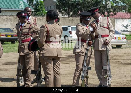 Kenyan police officers wearing ceremonial uniform march during the ...