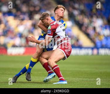 Wigan Warriors' Sam Walters is tackled during the Betfred Super League ...