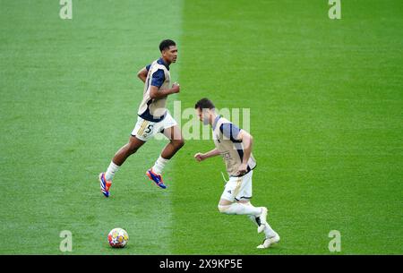Real Madrid's Jude Bellingham, left, and Barcelona's Pedri run for the ...