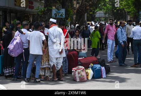MUMBAI, INDIA - JUNE 1: Passengers are awaiting a taxi outside Dadar ...