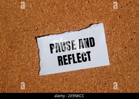 You are not alone text on torn brown paper with paper clip holder on ...