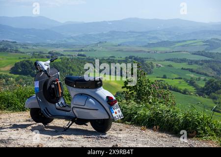 A traditional vespa parked at a viewpoint overlooking traditional ...
