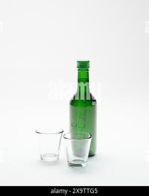 3d render of isolated korean soju bottles and glasses alcohoc beverage ...