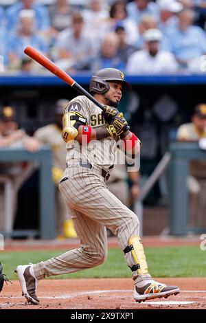 San Diego Padres' Luis Arraez, left, helps stretch out Padres' Fernando ...
