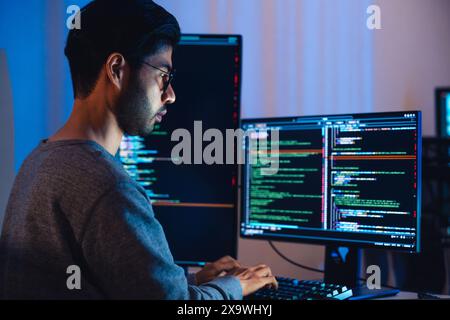 Indian software development working on coding computer screen and ...