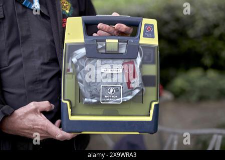 AED defibrillator, heart resuscitation electrical device displayed by a ...