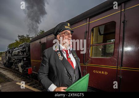Train guard signals for departure Stock Photo - Alamy