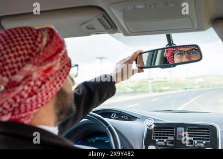 Cheerful arabic driver in his car Stock Photo - Alamy