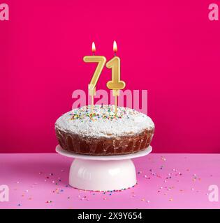 Pink number 71 birthday candle on white background Stock Photo - Alamy