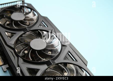 One graphics card on light blue background, top view. Space for text ...