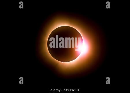 A solar eclipse featuring a diamond ring effect and baileys beads Stock ...