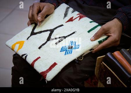 Artisan hands drawing design on wood plank using pencil and template ...