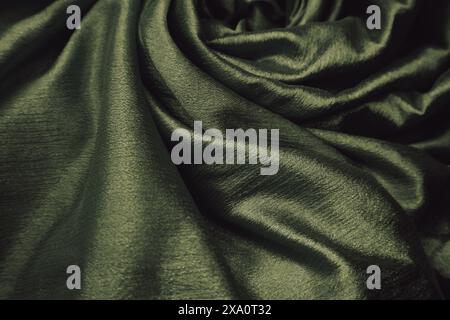 Smooth elegant green silk or satin luxury cloth texture can be used as ...