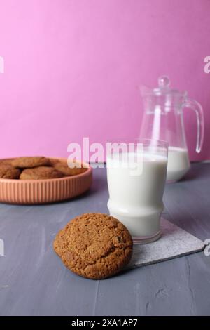 Baby eating afternoon snack on couch. Calm one year old toddler boy ...
