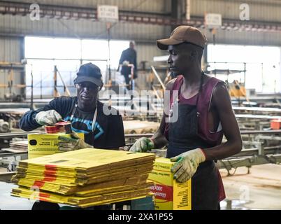 Kajiado, Kenya. 3rd June, 2024. A worker observes tiles to be processed ...