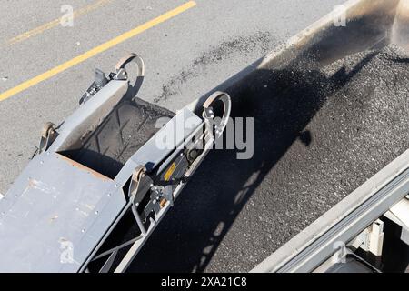 An aerial view of road maintenance with a milling machine working and ...