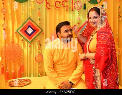 An Indian Sister gives blessings to the brother by putting tika on his ...