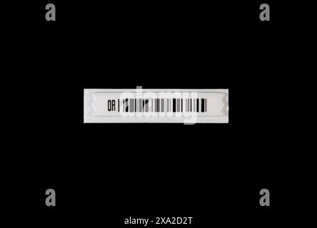 Anti-theft magnetic barcode label on black backdrop Stock Photo - Alamy