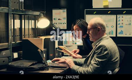 Investigators studying historical maps of crime scenes using federal ...