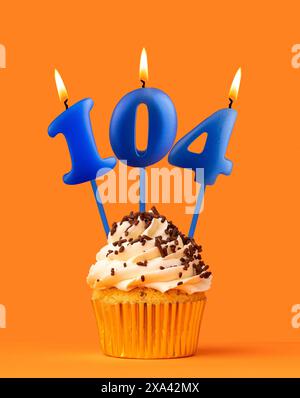 birthday cake with number 104 - cupcake on orange background with ...