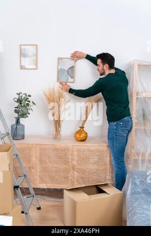 The man moving house with boxes Stock Photo - Alamy