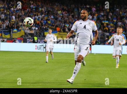 Jonathan Tah #04 of Germany control the ball during the 2026 FIFA World ...