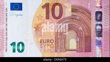 Detail on 10 euro banknote. Close up of banknote laid out on table ...