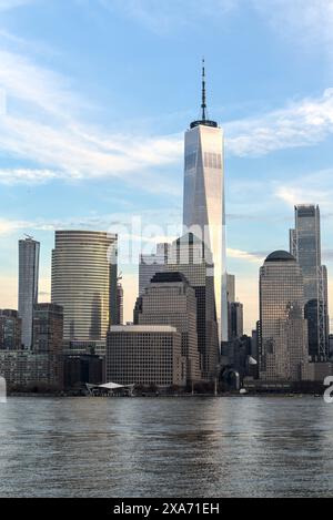 wooden bench on rooftop leading to view of downtown nyc (one world ...