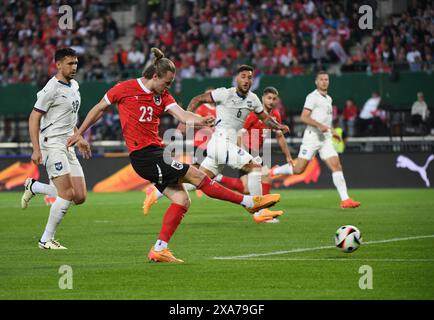 VIENNA, AUSTRIA - JUNE 7: Patrick Wimmer of Austria fights for the ball ...
