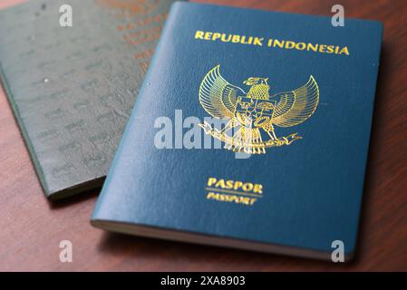 Indonesian passport on a wooden background Stock Photo - Alamy