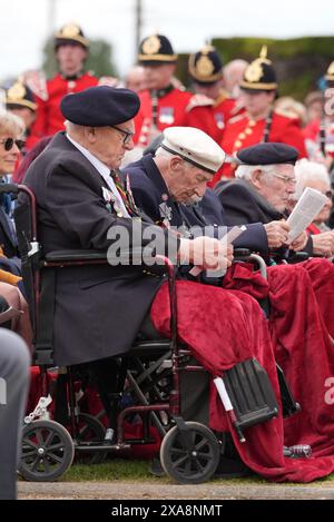 Veterans Ken Hay (second left) and John Dennett (centre) watch a parade ...