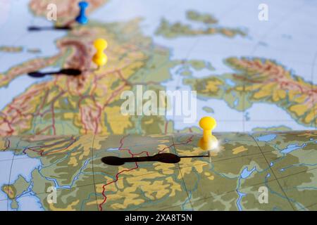 Yellow and blue pushpin showing the location of a destination point on ...