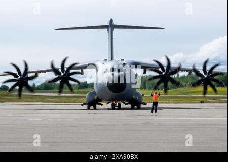 A Luftwaffe Airbus A400M Atlas lands on a runway at Joint Base ...