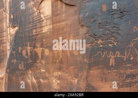 Prehistoric Fremont Culture petroglyphs depicting warriors with shields ...