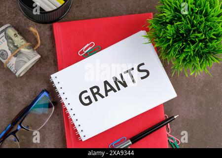 GRANT word, text written on a blank sheet of a notebook. View from ...