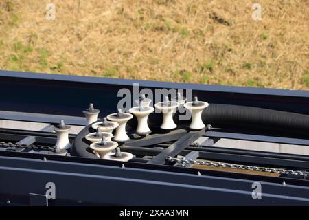 Deflection rollers on a roof of a vacuum truck Stock Photo - Alamy