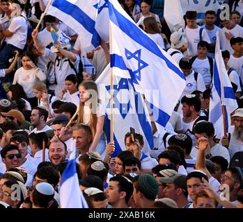Israelis wave national flags during a march marking Jerusalem Day, an ...