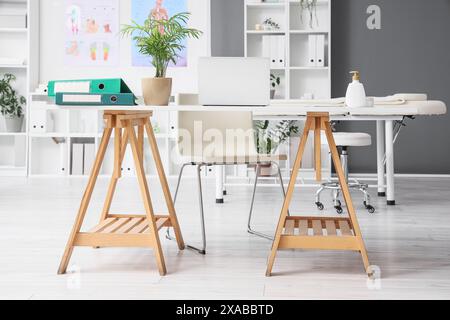 Massage therapist's workplace with laptop in medical office Stock Photo ...