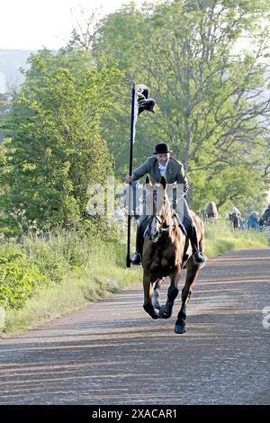 Ryan Nichol carries the unbussed 'Banner Blue' flag. Leads the ...