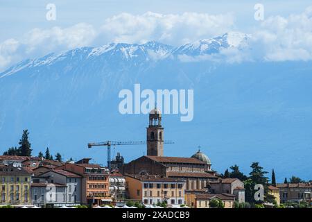 Lake garda, mountains and the town of Salò during a beautiful spring ...