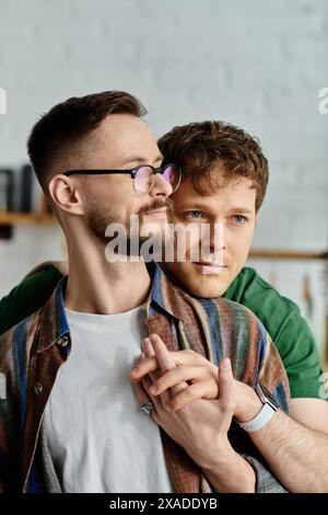 Two men collaborate in designer workshop on trendy attire Stock Photo ...