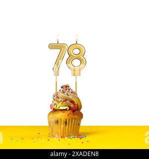 Birthday candle with cupcake - Number 78 on black background with out ...