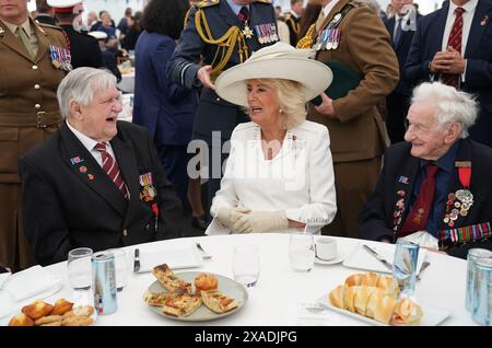 Queen Camilla speaks with veterans Arthur Oborne (left) and Albert Keir ...