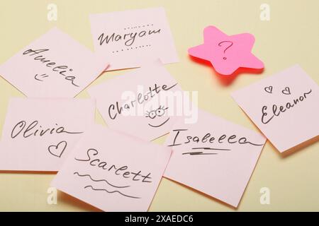 Paper stickers with different names on wooden background. Concept of ...