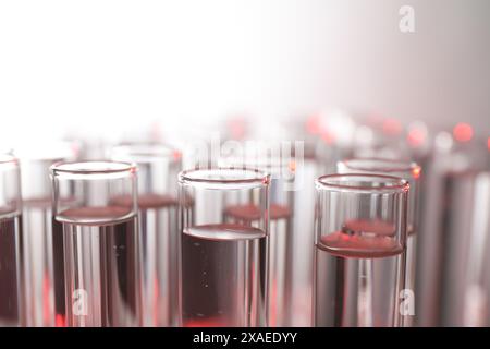 Many glass test tubes on violet background, closeup Stock Photo - Alamy