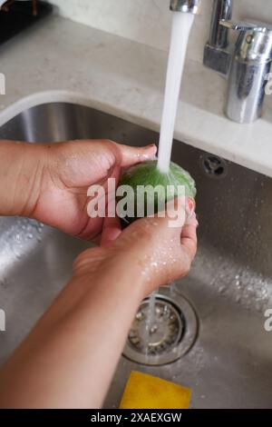 hand washing avocado with water sprinkling Stock Photo - Alamy