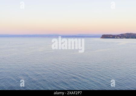 Panoramic sunset sky with vibrant pink and orange clouds against a deep ...